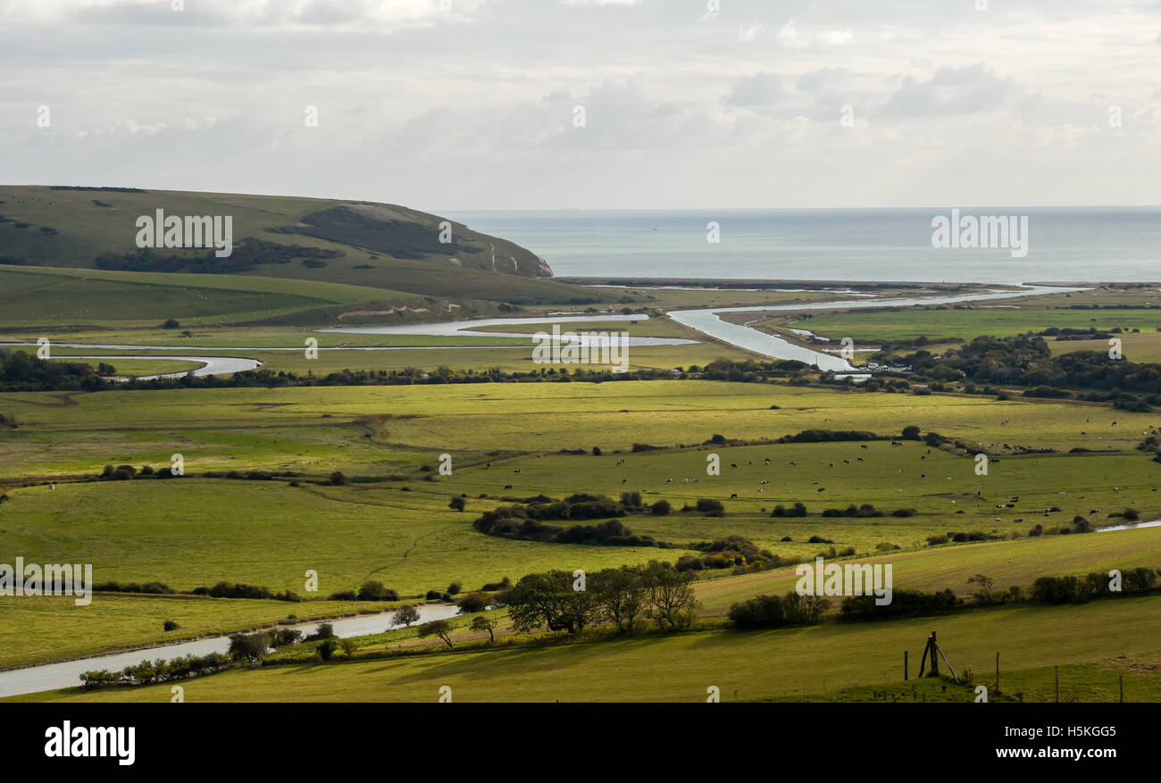 Cuckmere Haven lies on the coast and is an area of flood plains where ...