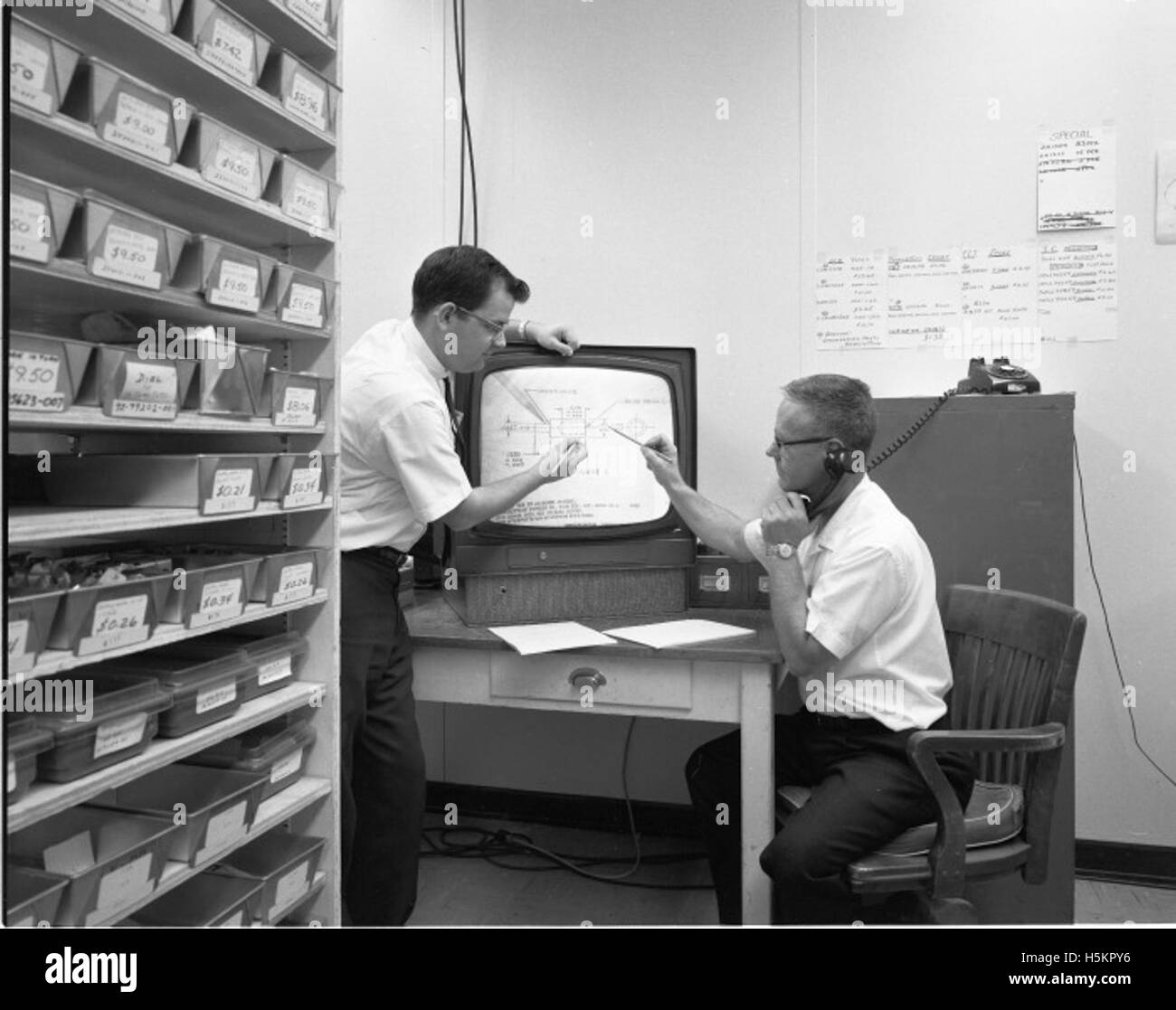 Photograph from the Atlas Collection showing a large cargo ship at port ...