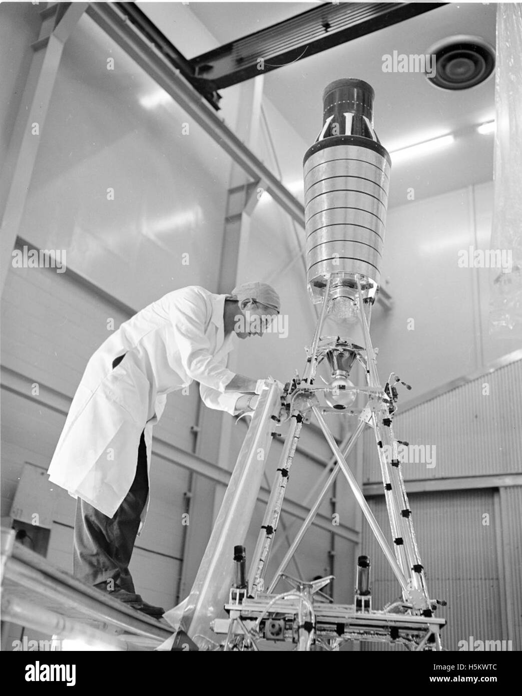 A historical photograph showing the Atlas rocket with its payload ...