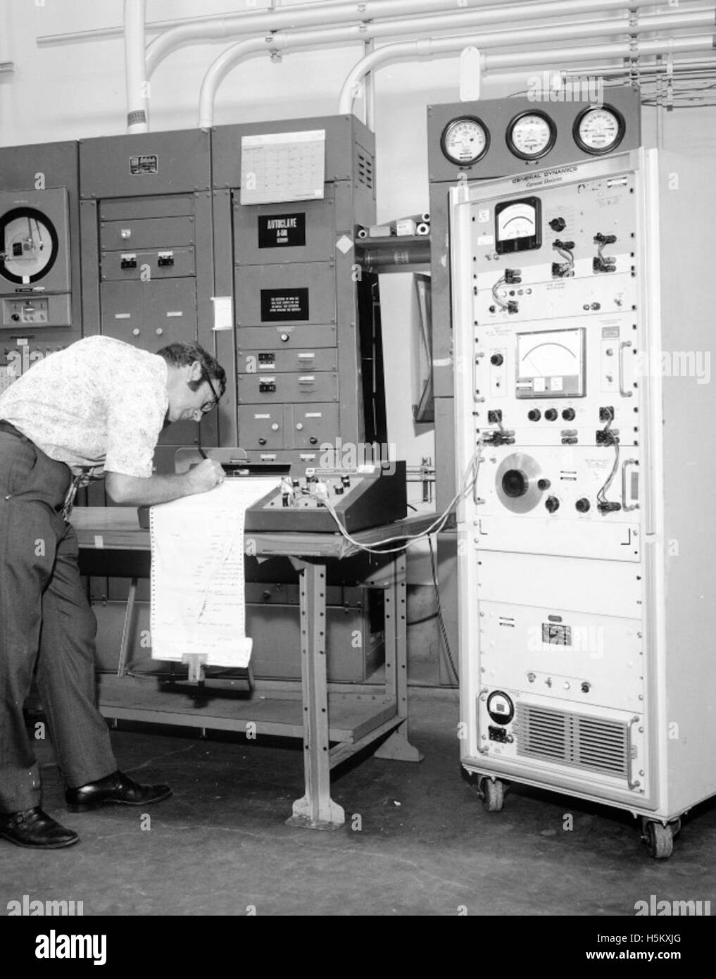 A photograph from the Atlas Collection showing a rocket being prepared ...