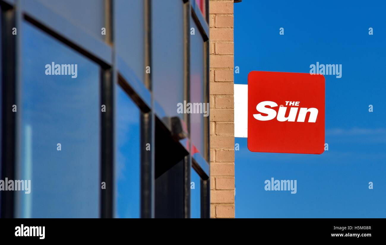 The Sun newspaper shop sign Stock Photo - Alamy
