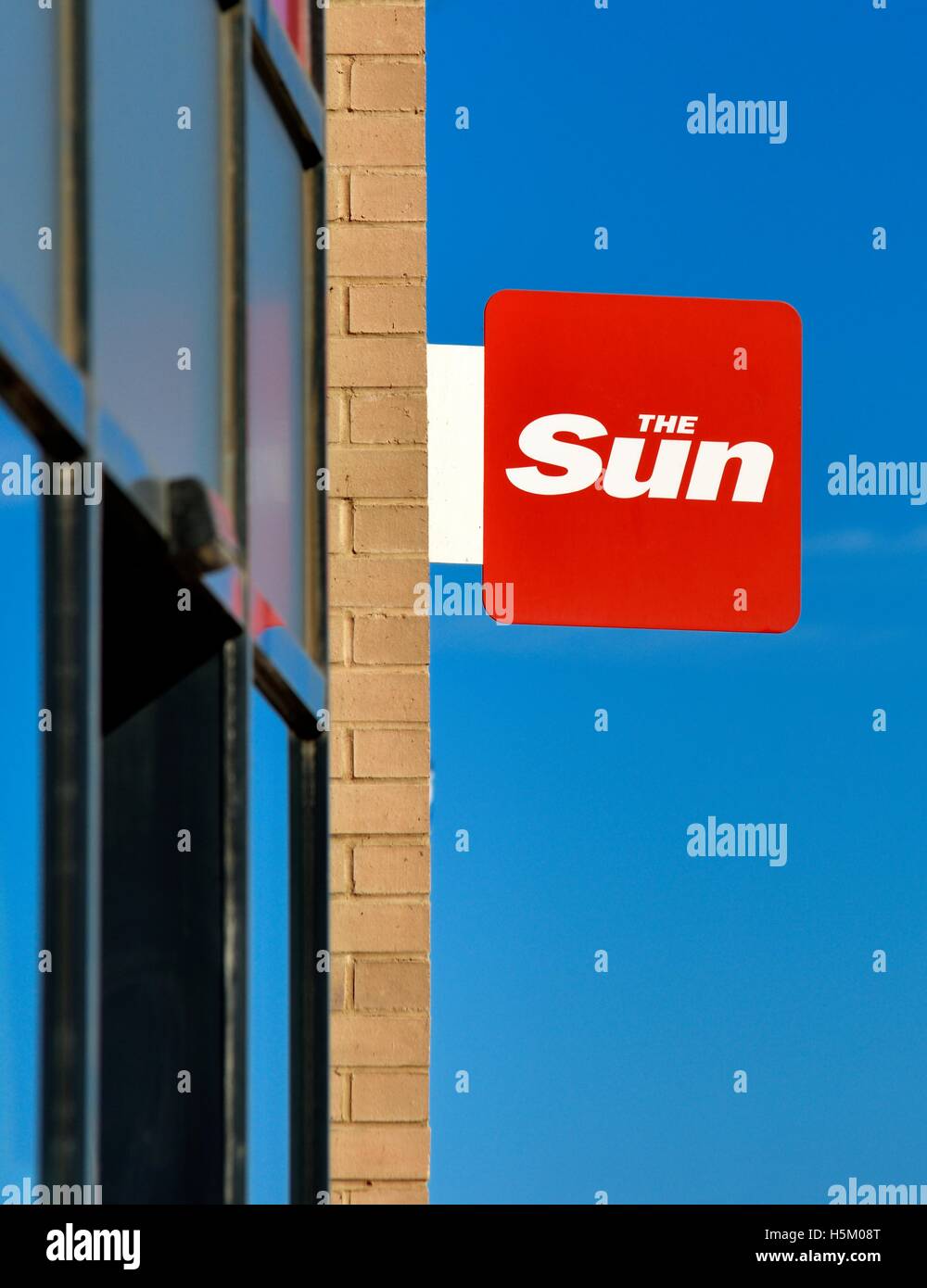 The Sun newspaper shop sign Stock Photo - Alamy