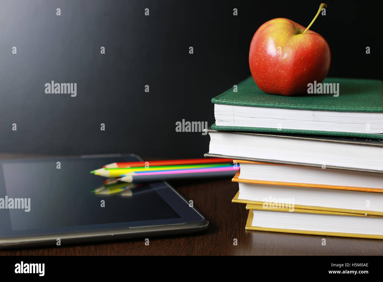 Education an apple and books Stock Photo - Alamy