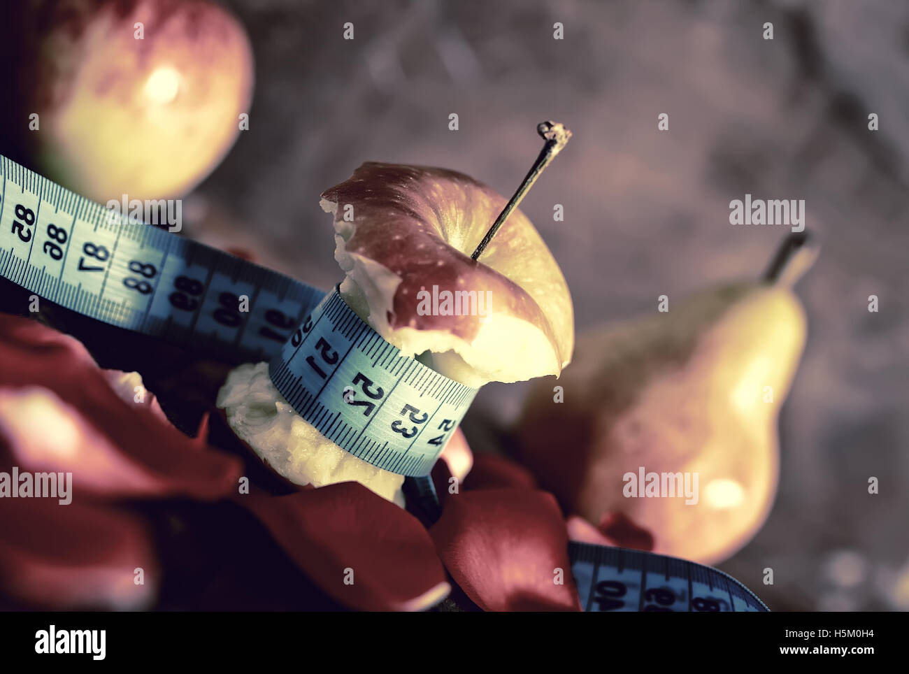 anorexia thinness measuring apple Stock Photo - Alamy