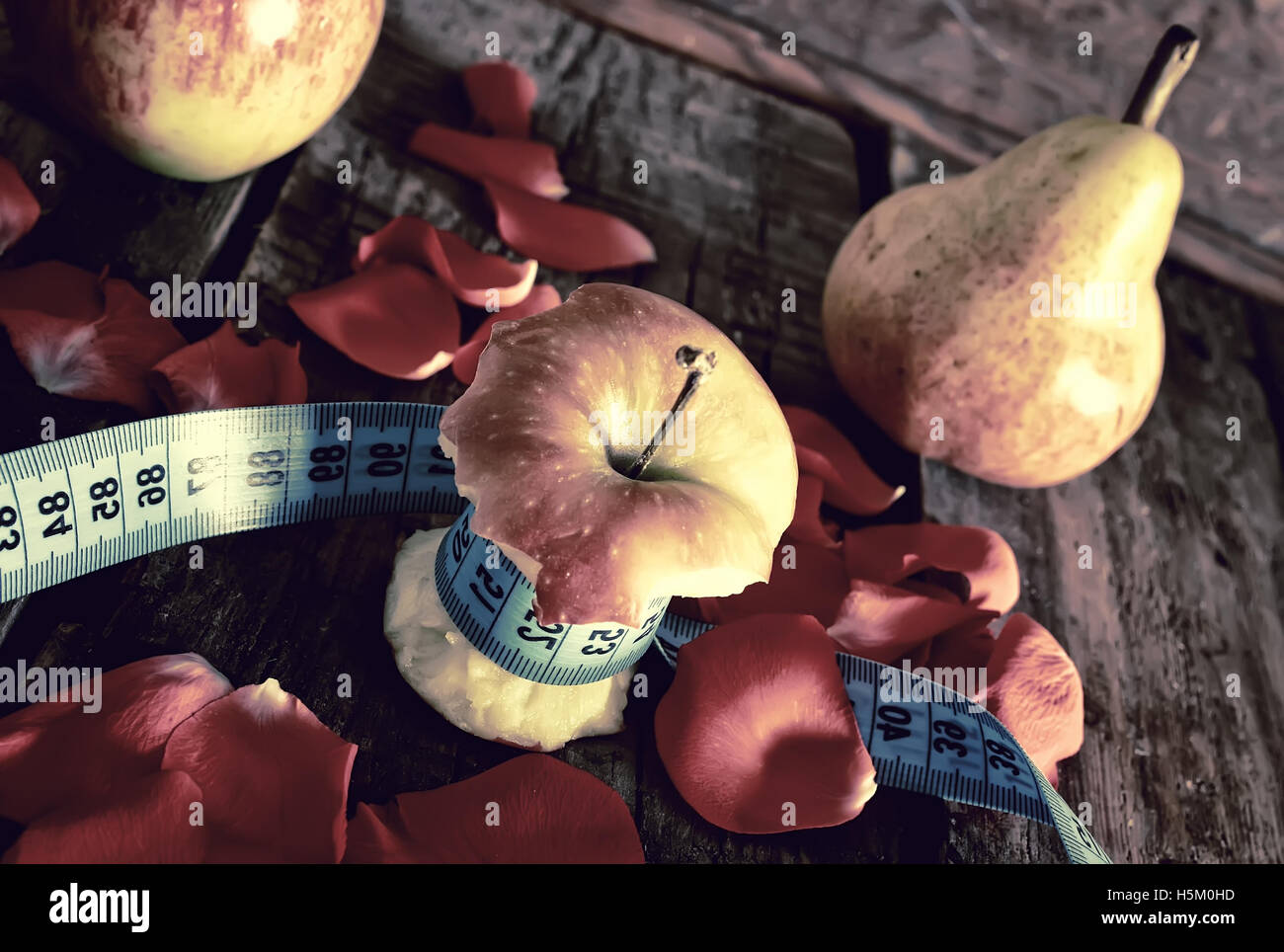 anorexia thinness measuring apple Stock Photo - Alamy