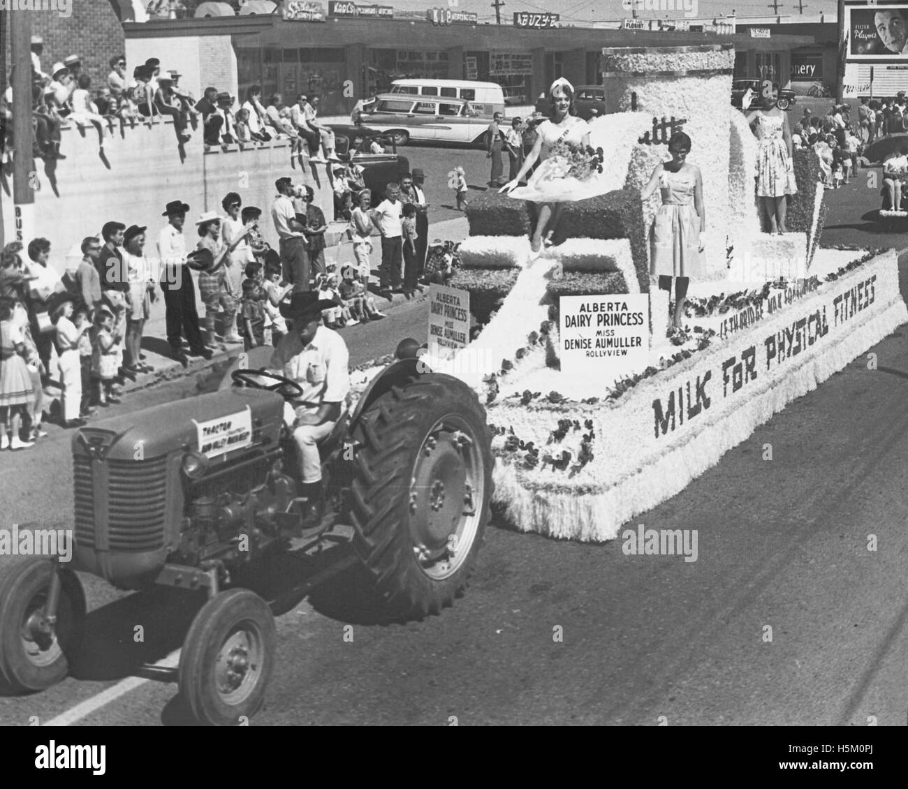 Denise Aumuller, the Alberta Dairy Princess, sitting on a float during ...