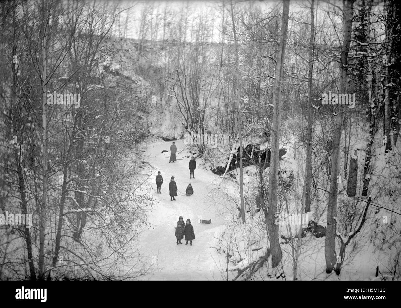 The McCalla family is seen skating in a ravine in Alberta, Canada ...