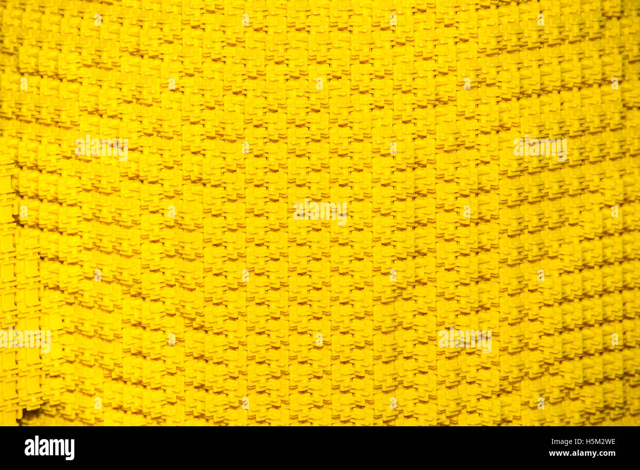 Plastic yellow construction blocks Stock Photo - Alamy