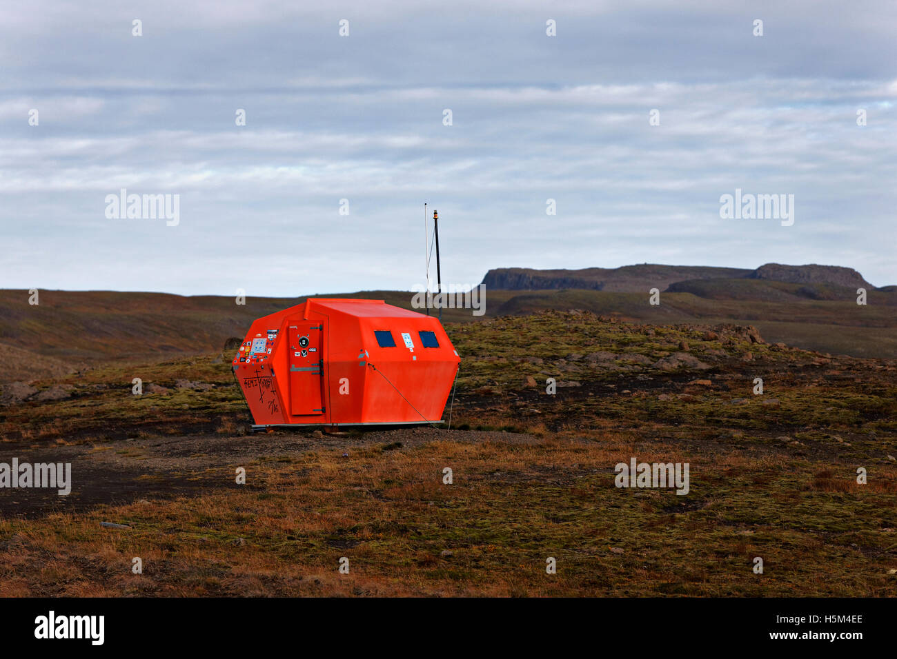 Emergency protection shelter in volcanic landscape, Westfjörds, Iceland ...