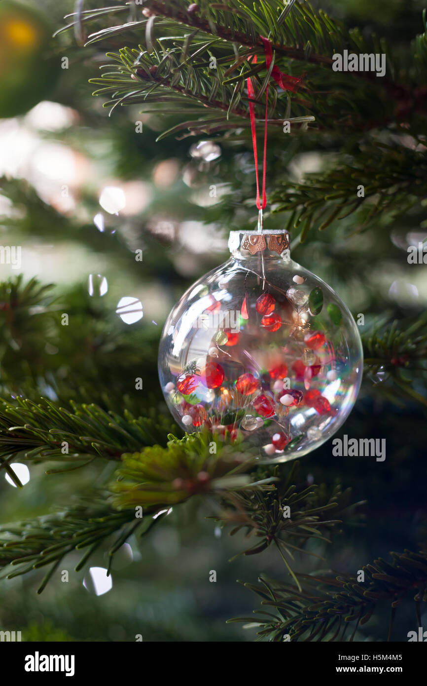 Glass bauble hanging on a Christmas tree Stock Photo - Alamy