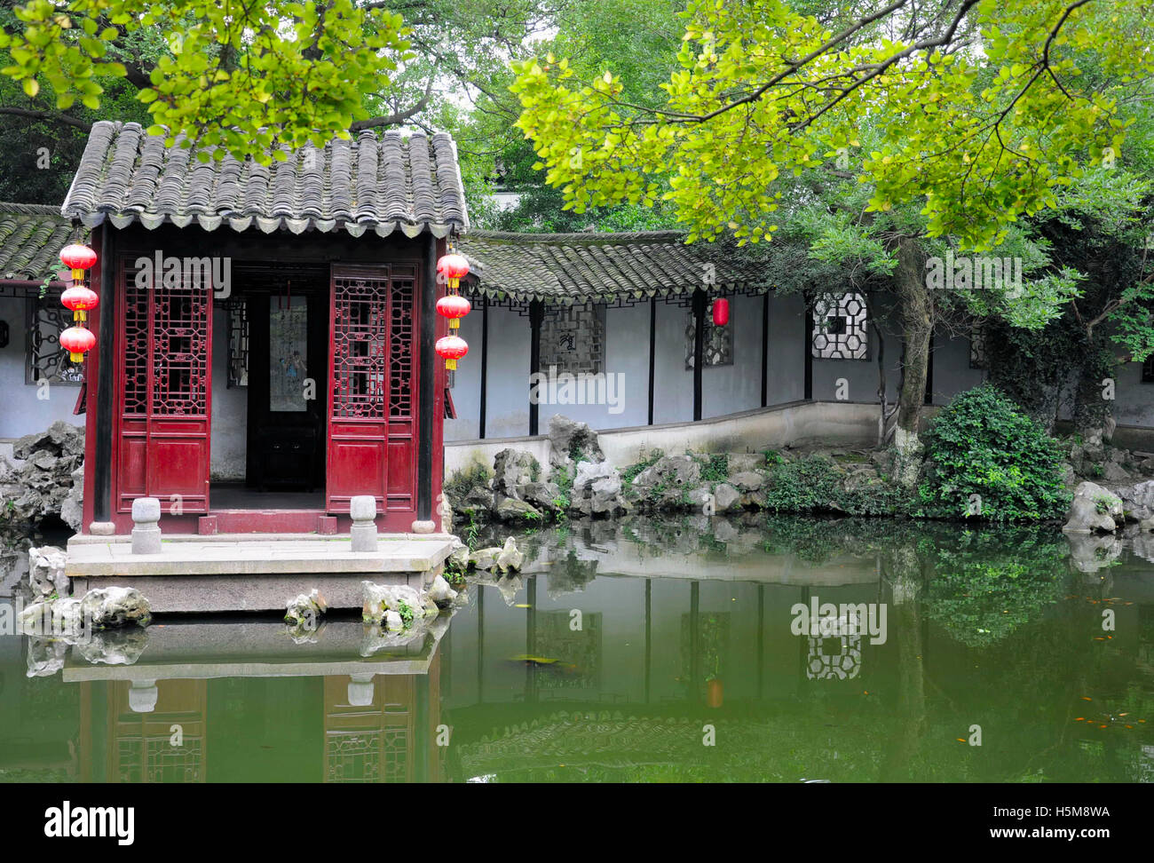 Chinese architecture and a pond within a traditional Chinese Garden in ...