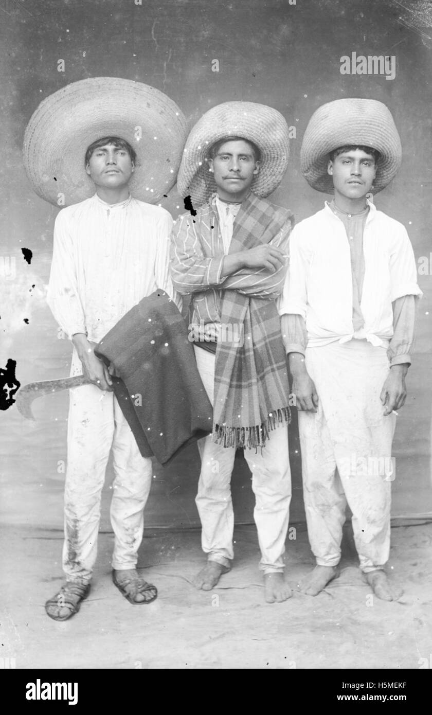 The image likely shows three young men wearing traditional Mexican ...