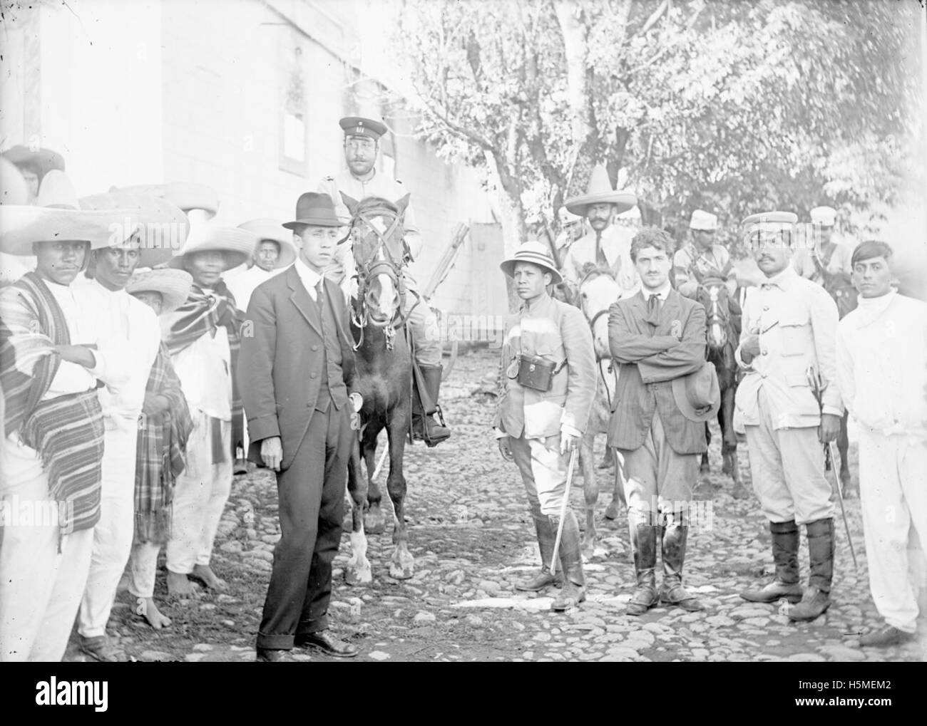 A historical image showing a group of civilians and soldiers from the ...