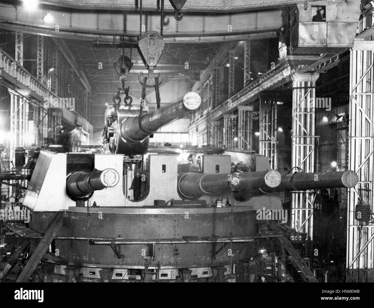 This photograph shows the installation of a 14-inch quadruple gun ...