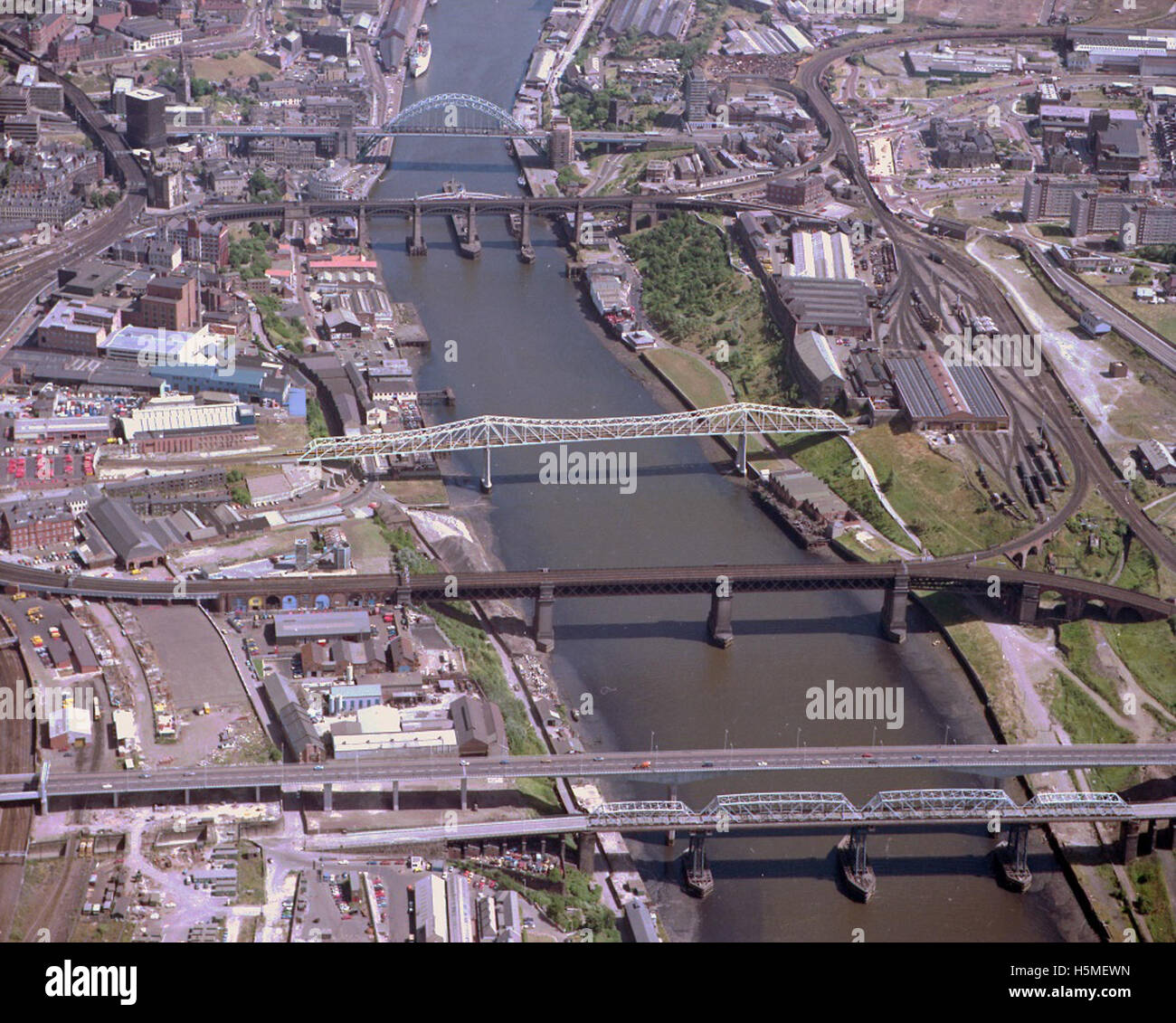 A 1983 aerial view showing several bridges across the River Tyne ...