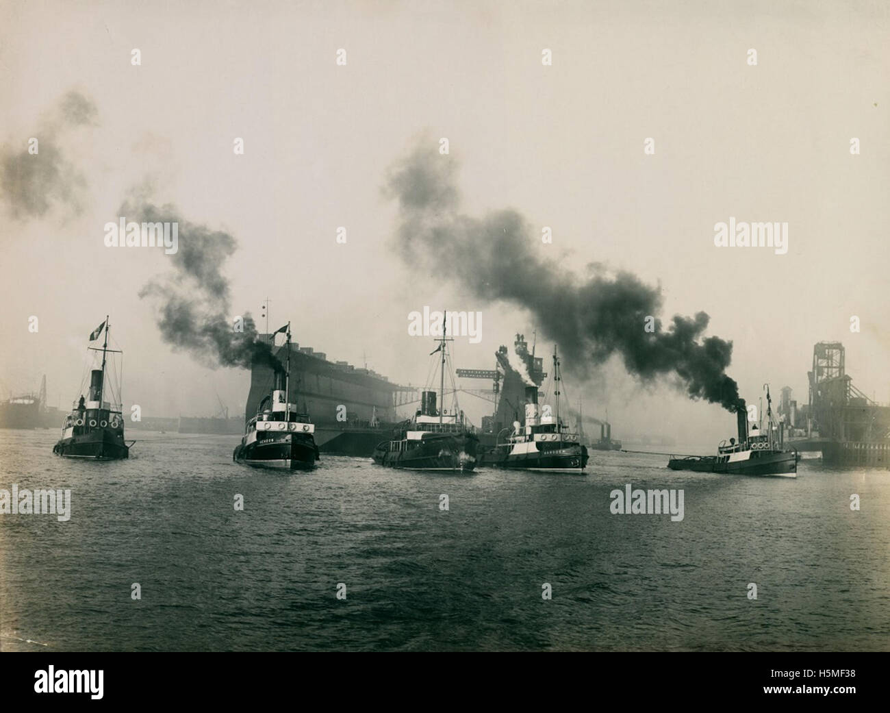 The image captures tugboats towing the world's largest floating dock on ...