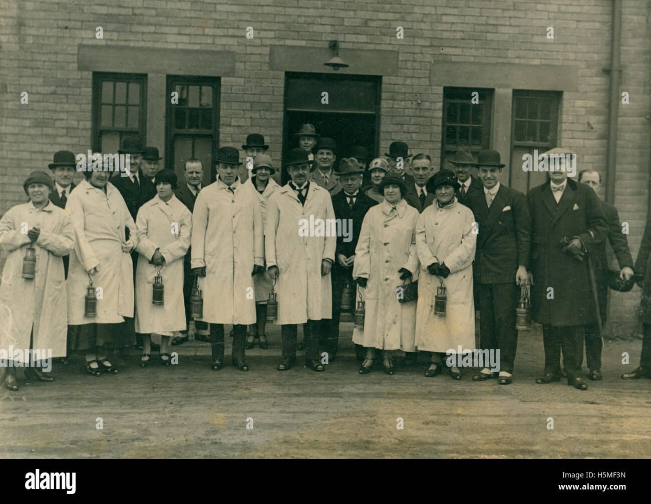 The image shows a group preparing to descend into Ellington Colliery, a ...