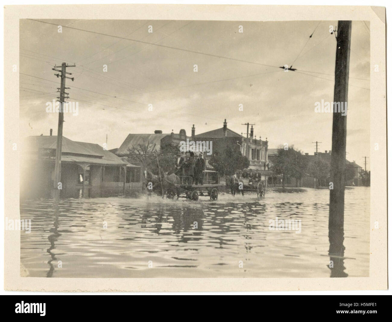 This photograph shows a flooded shop with a prominent Cassidy's sign ...