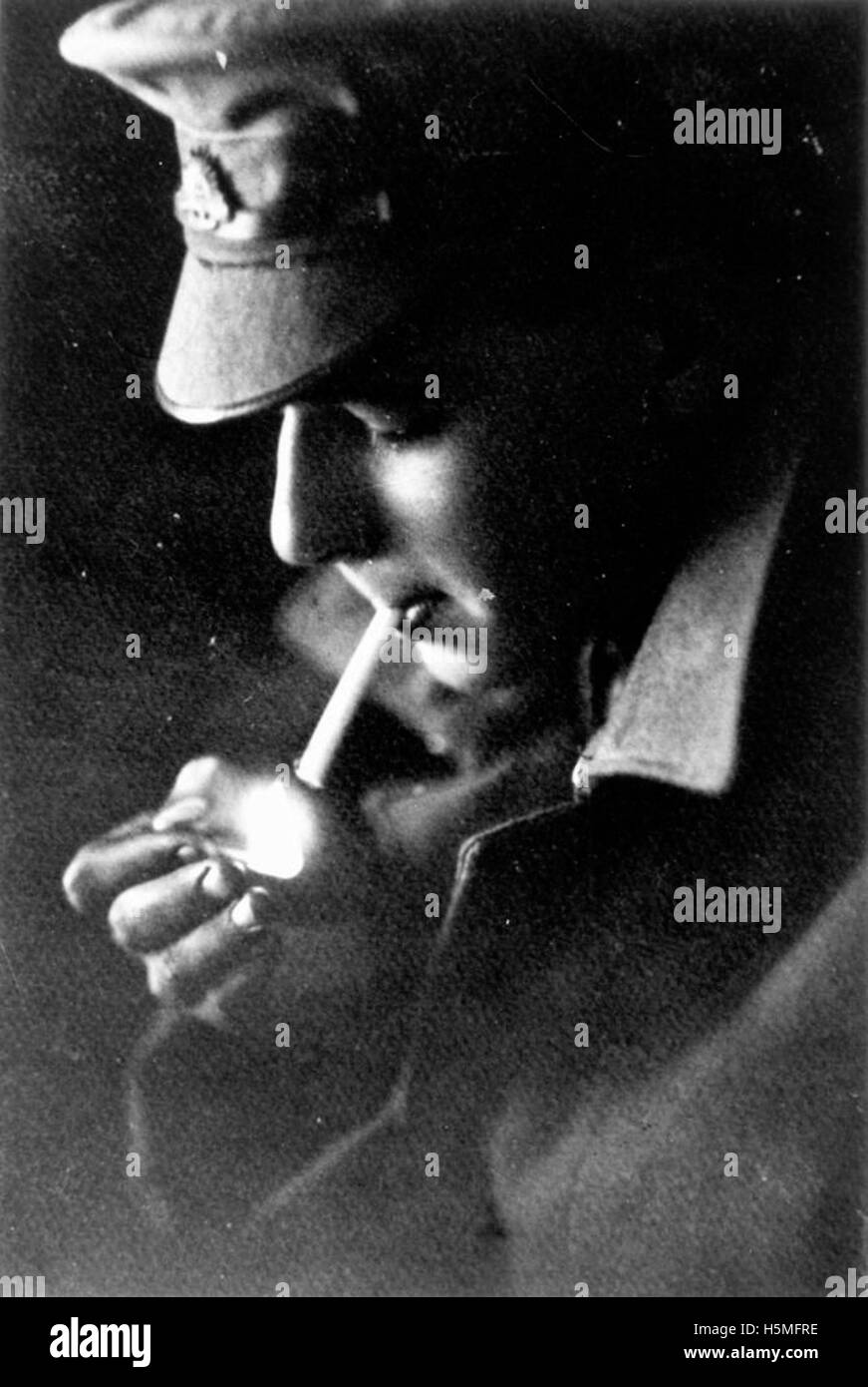 A World War I soldier named A Franz is seen lighting a cigarette in ...