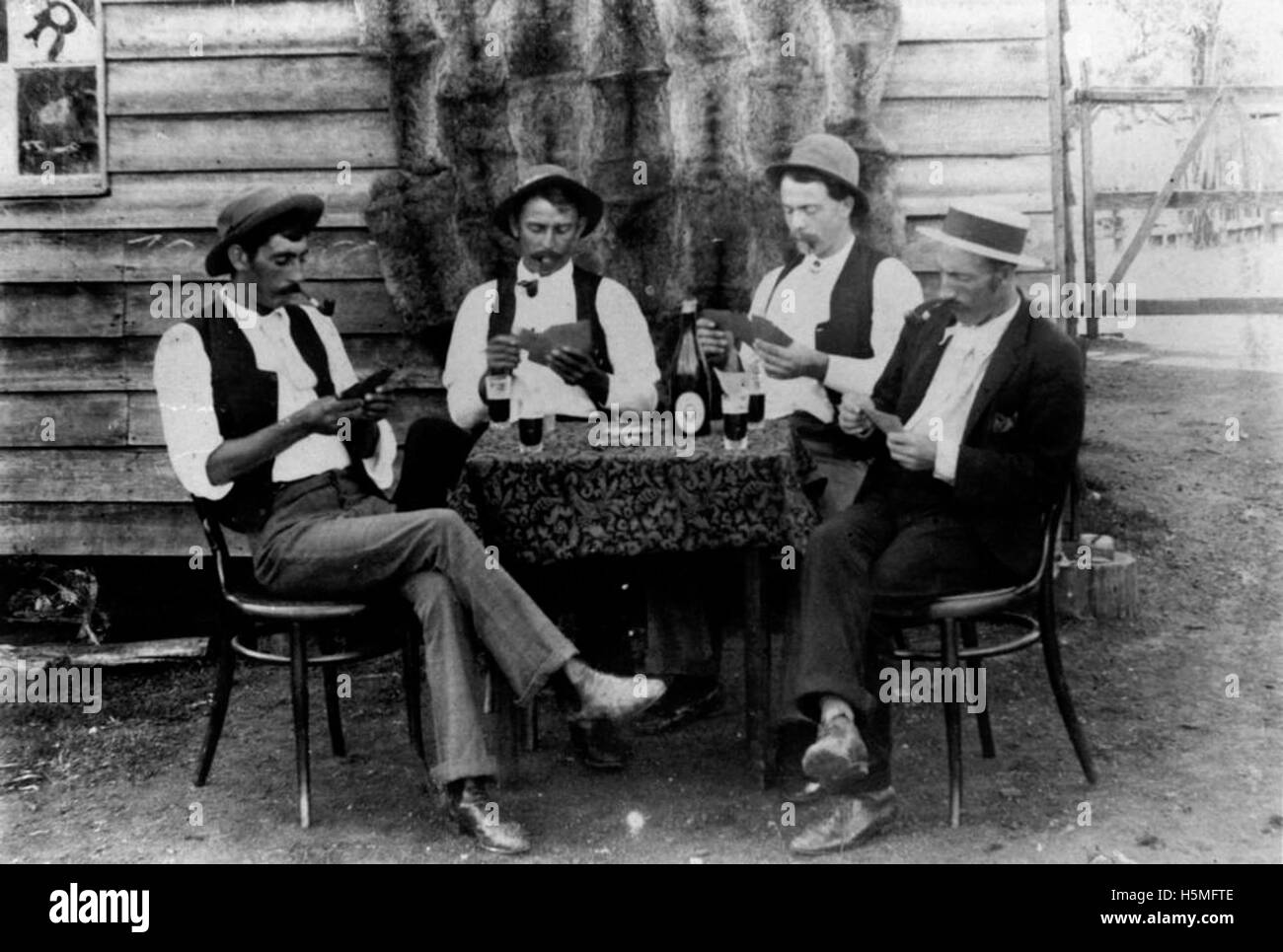 A historical photograph showing men playing cards in Gin Gin ...