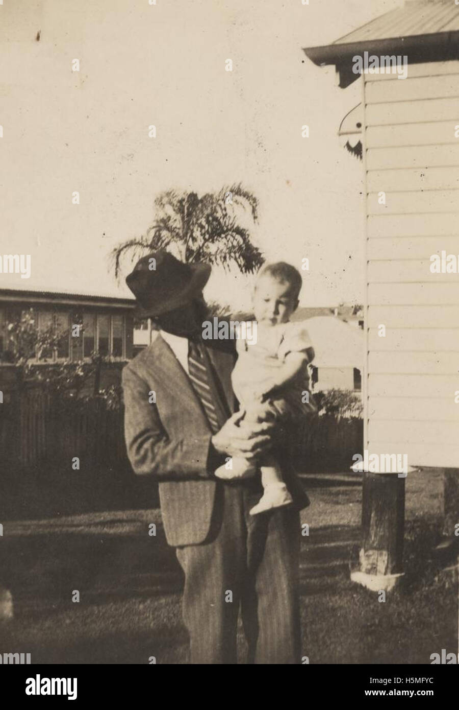 Jerry Palmos and his baby son Denny are pictured in East Brisbane ...