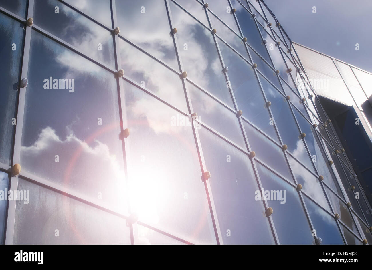 the sun and the sky in a glass building Stock Photo - Alamy