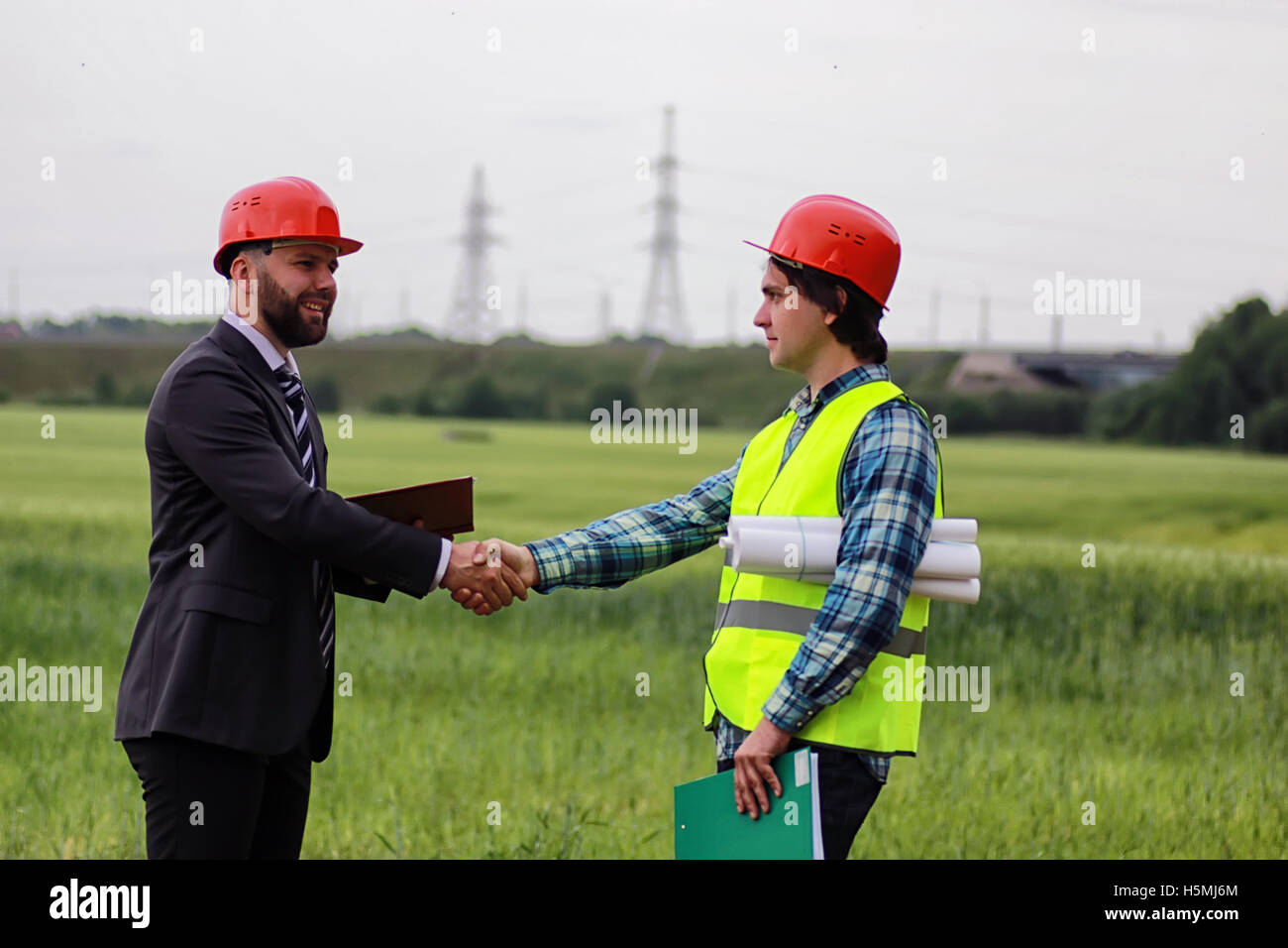 construction two man in the field Stock Photo - Alamy