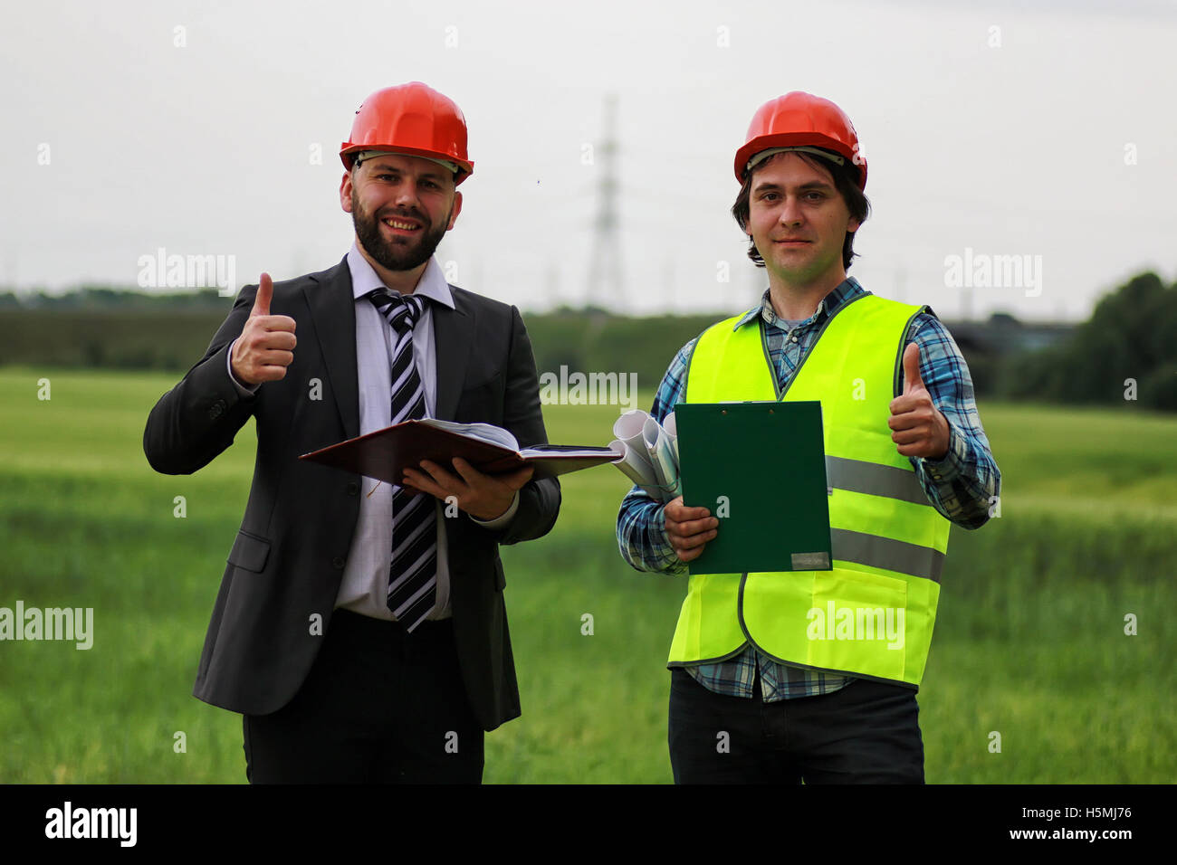 construction two man in the field Stock Photo - Alamy