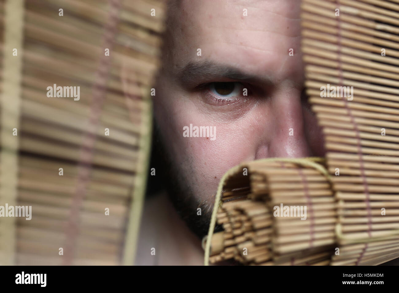 angry man at the jalousie Stock Photo - Alamy