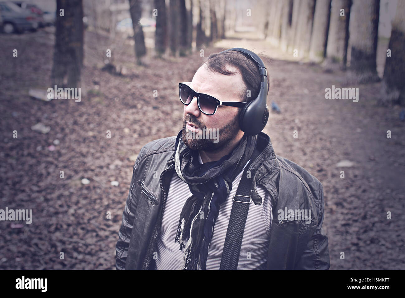 retro toned effected photo of alone man on street Stock Photo - Alamy