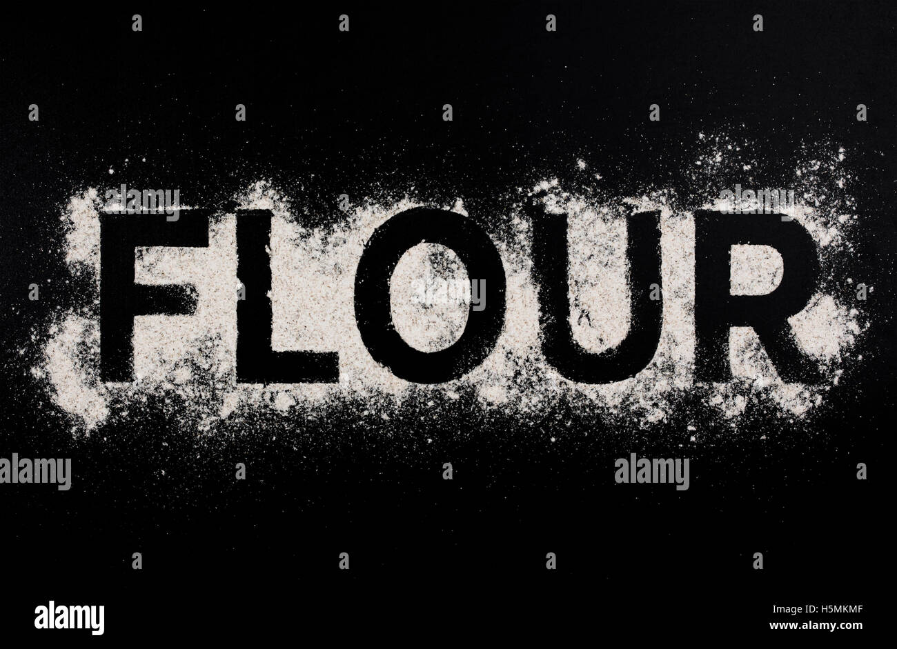 Word flour made from white flour on a dark table Stock Photo - Alamy