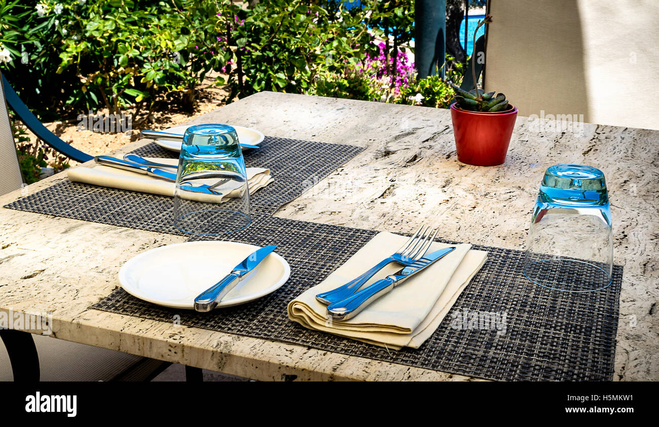 Mediterranean restaurant dinner set for two on a marble table Stock ...