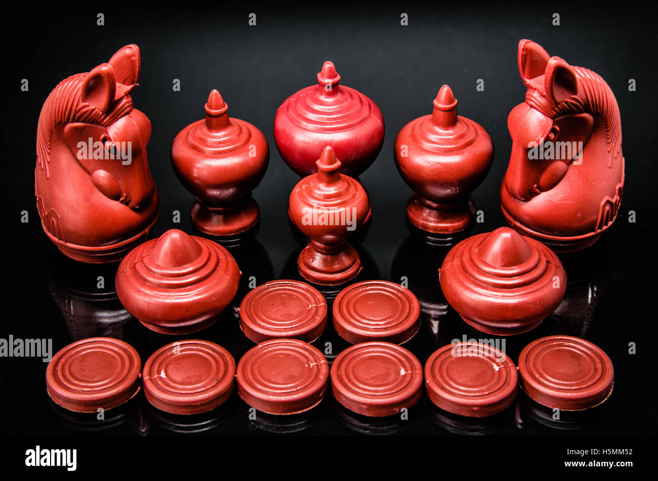 Group of Red Thai chess piece with black background and selective focus ...