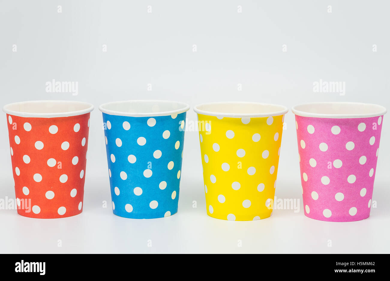 Sequence of Colorful paper cup on white background and selective focus ...