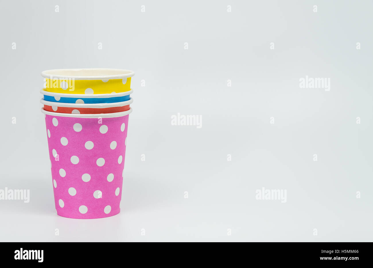 Stack of Colorful paper cup on white background and selective focus ...