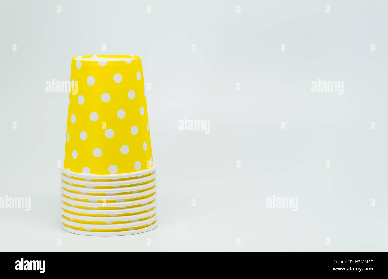 Stack of Yellow paper cup on white background and selective focus Stock ...