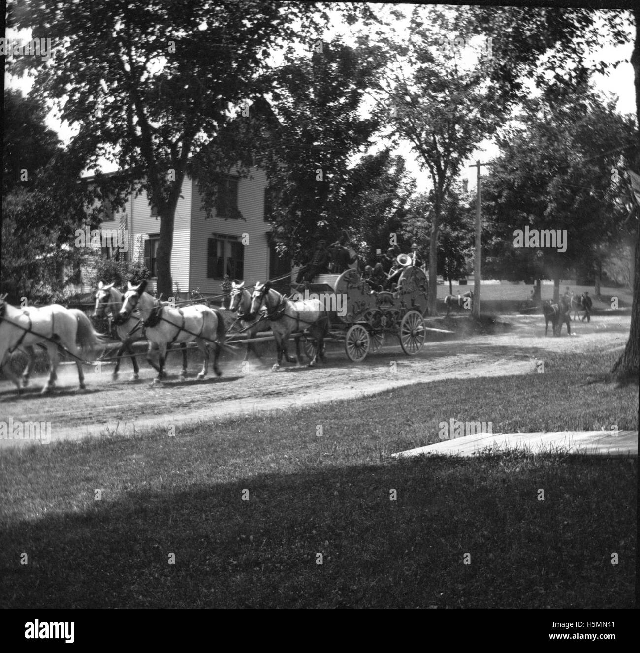 A historical photograph depicting a circus parade on July 11, 1898. The ...