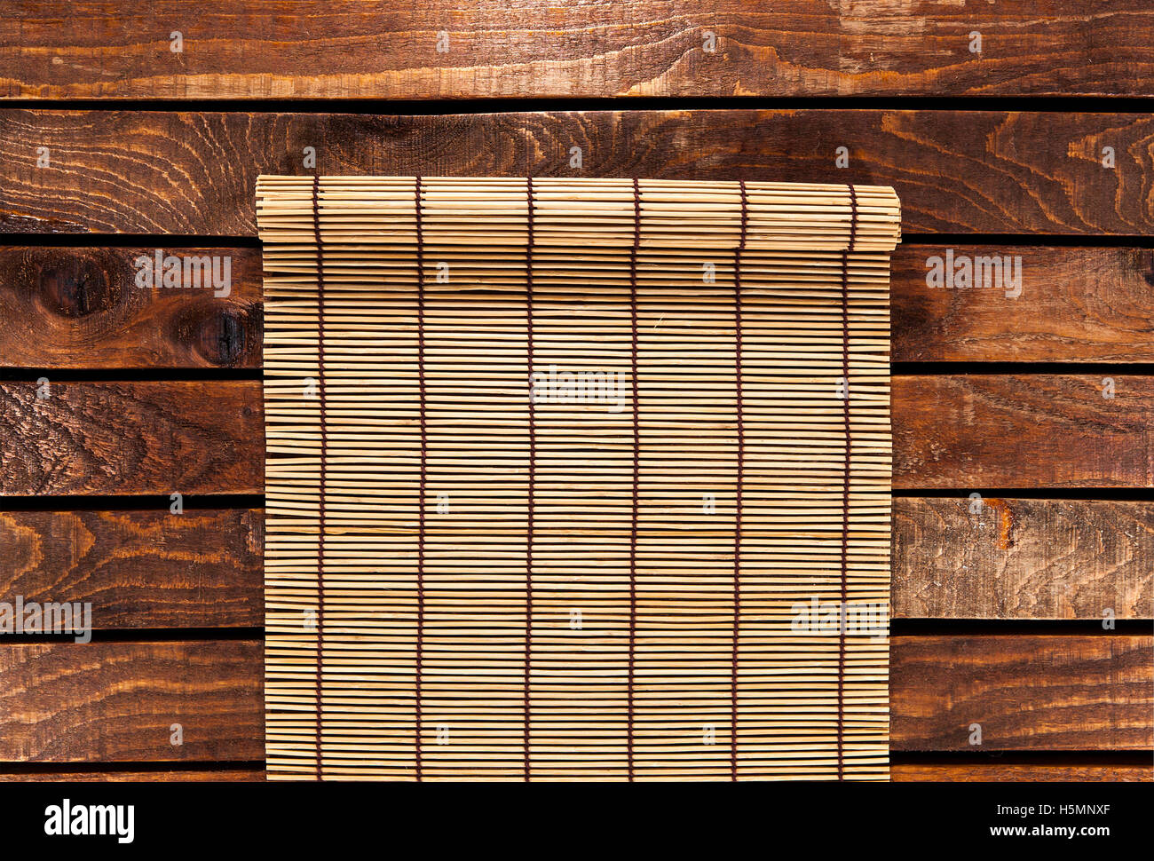 bamboo napkin on wooden table. top view Stock Photo - Alamy