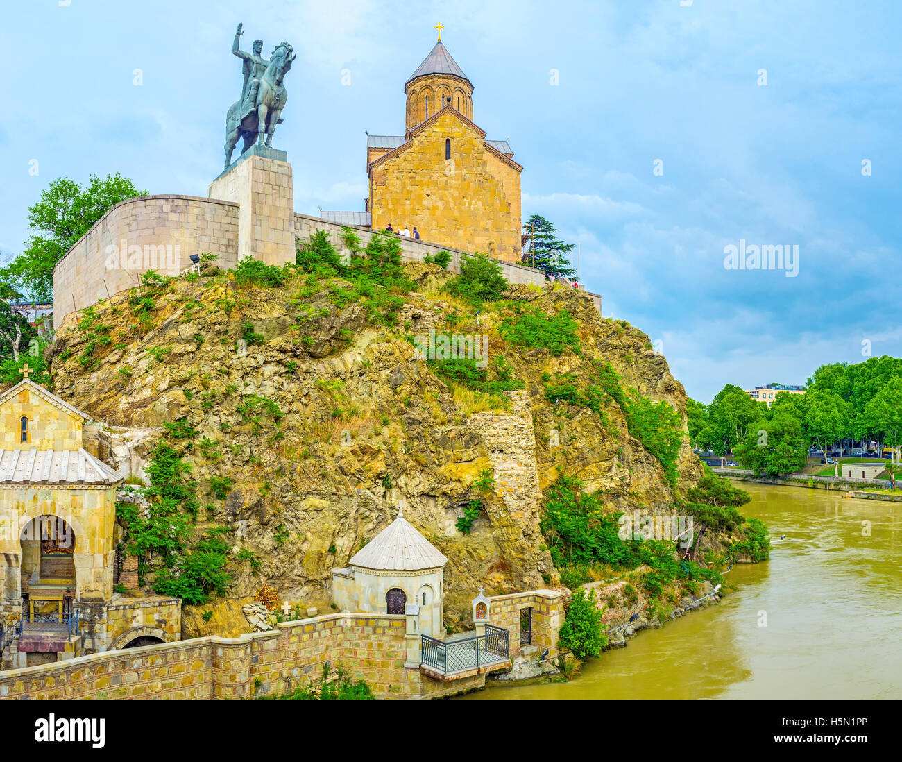 The rocky cliff in Tbilisi city center is occupied with Metekhi ...