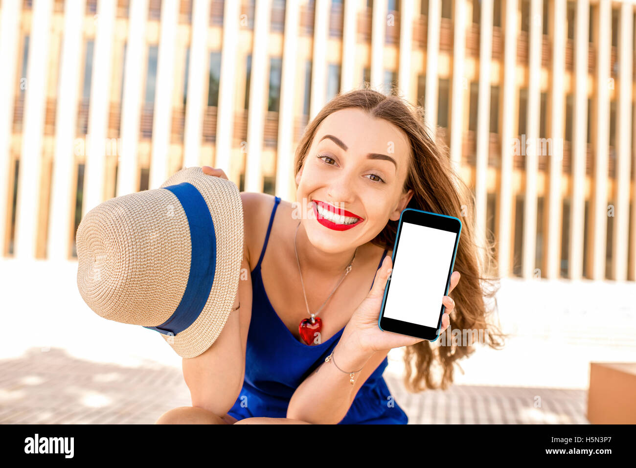 Woman with phone outdoors Stock Photo - Alamy