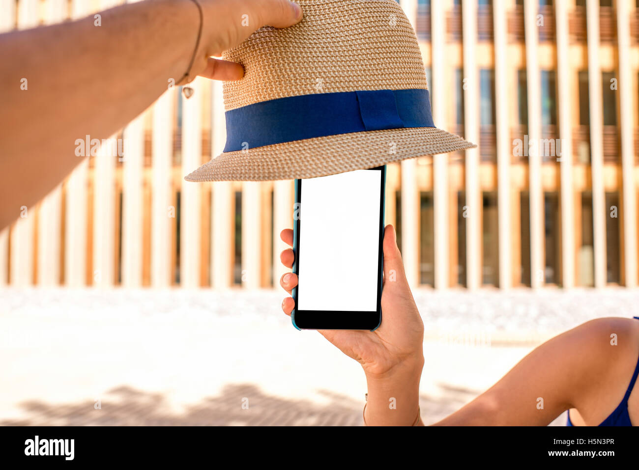 Phone with white screen outdoors Stock Photo - Alamy