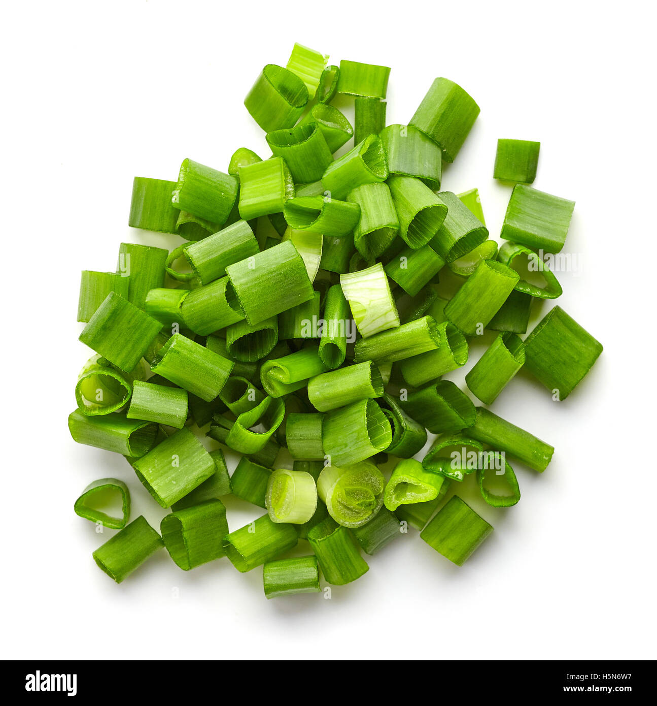 Heap of chopped spring onions isolated on white background, top view ...