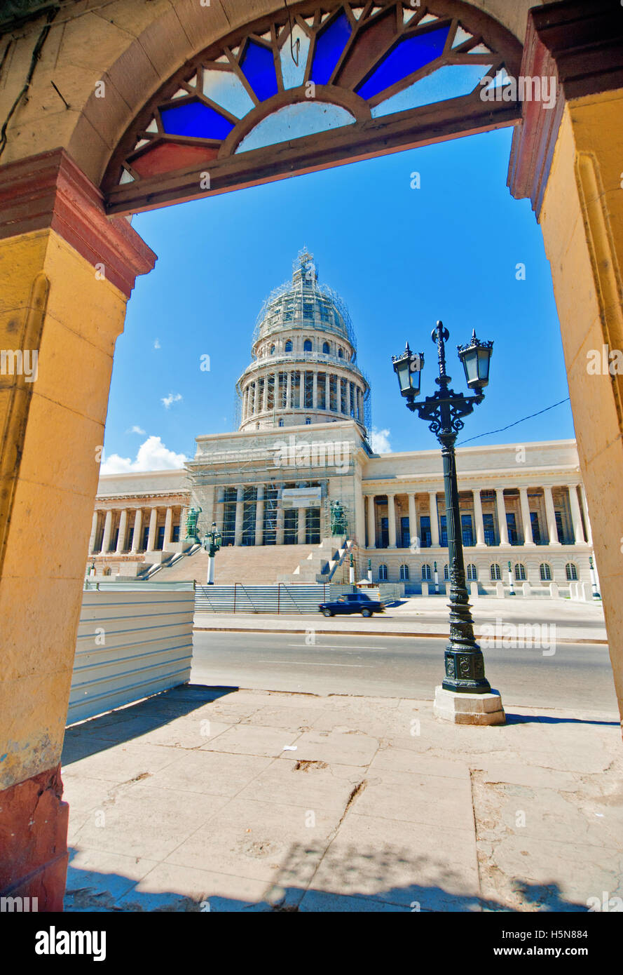 View of Havana Capitol building and building arch with traditional ...