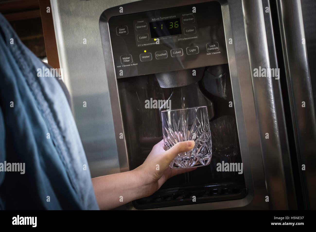 Young adult drinking water Stock Photo - Alamy