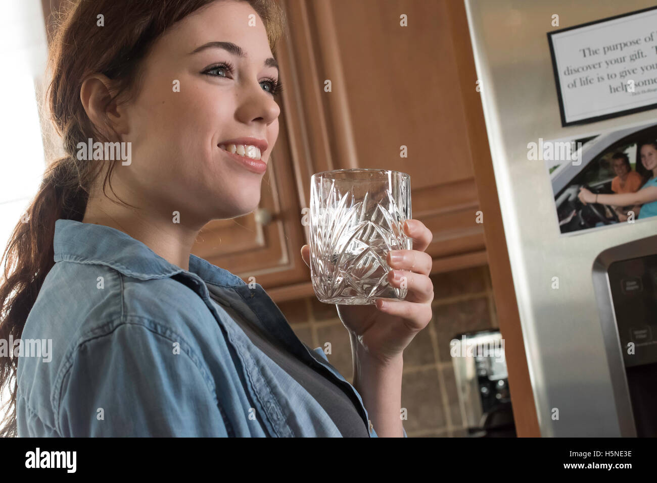 Young adult drinking water Stock Photo - Alamy