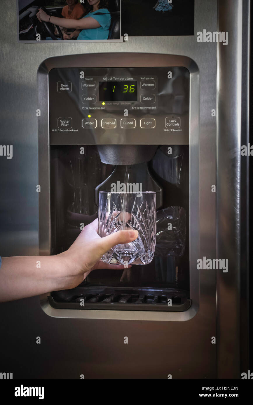 Young adult drinking water Stock Photo - Alamy