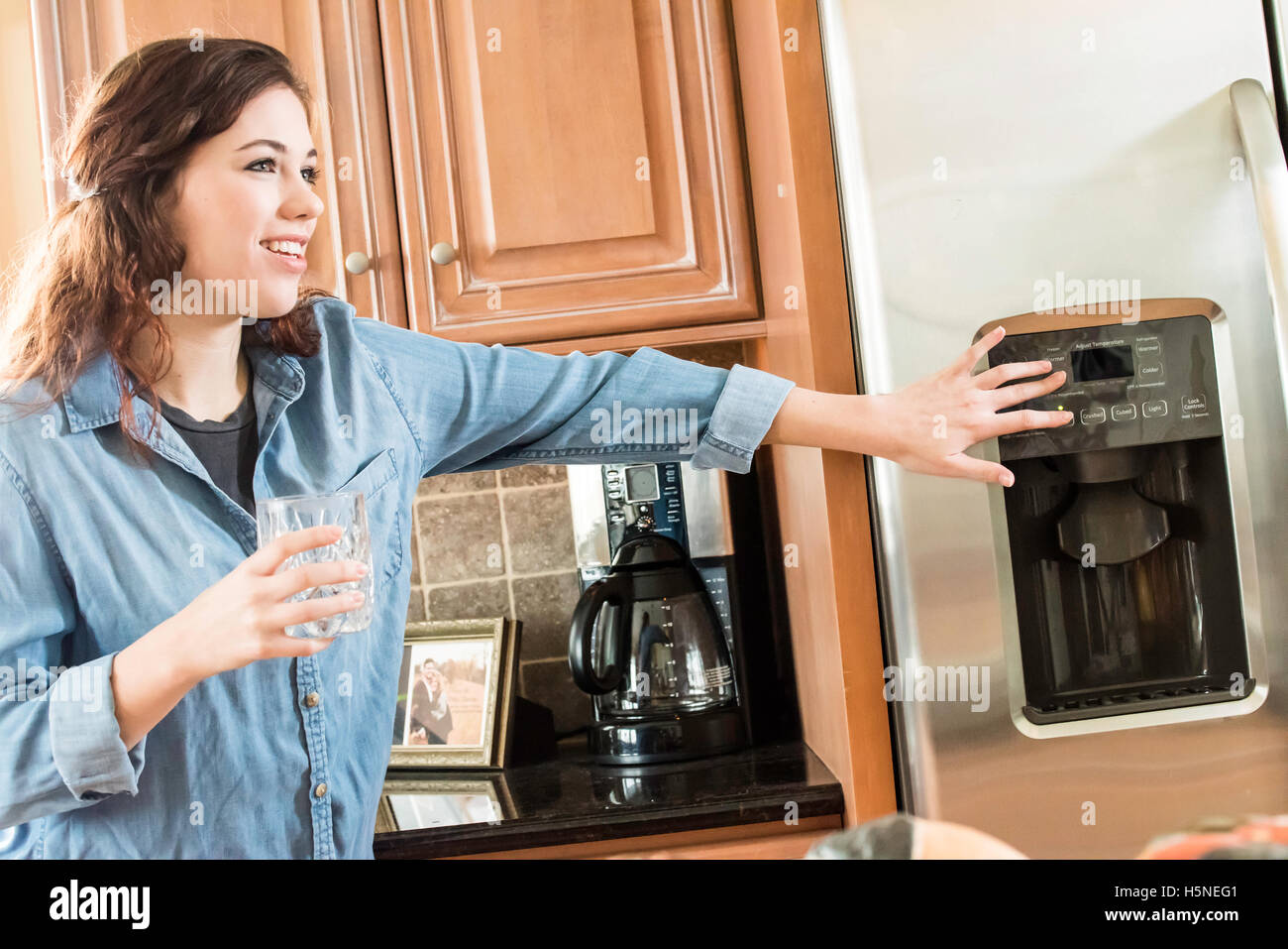 Young adult drinking water Stock Photo - Alamy