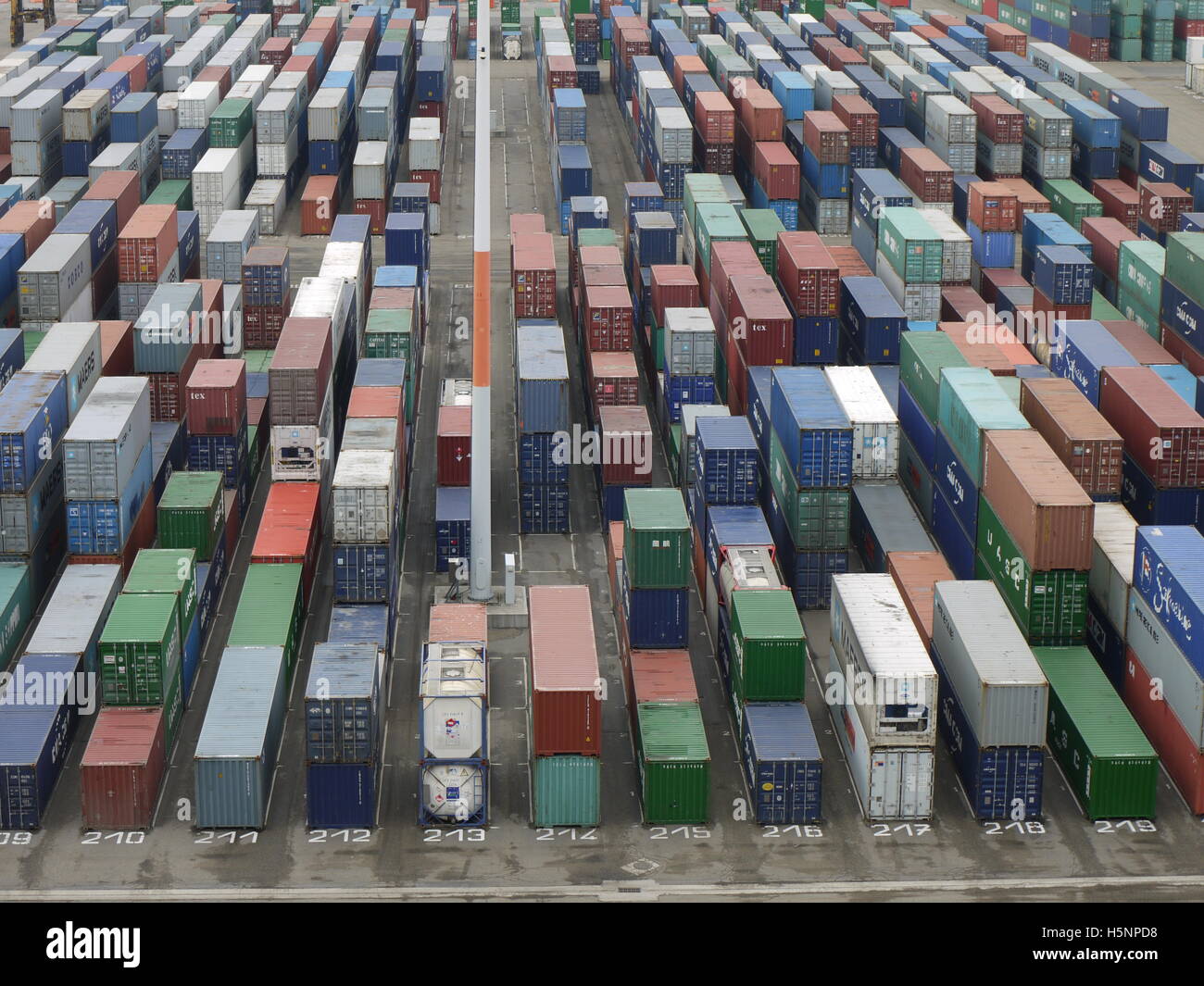 Containers waiting to be loaded on the dock of the Port of Rotterdam ...