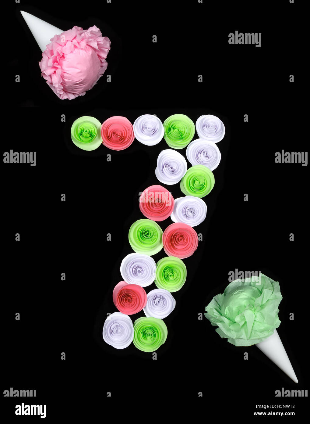 Decorative figure of seven lined paper flowers Stock Photo - Alamy