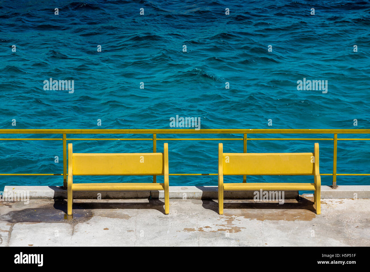 Yellow Benches in Curacao Harbor Stock Photo - Alamy